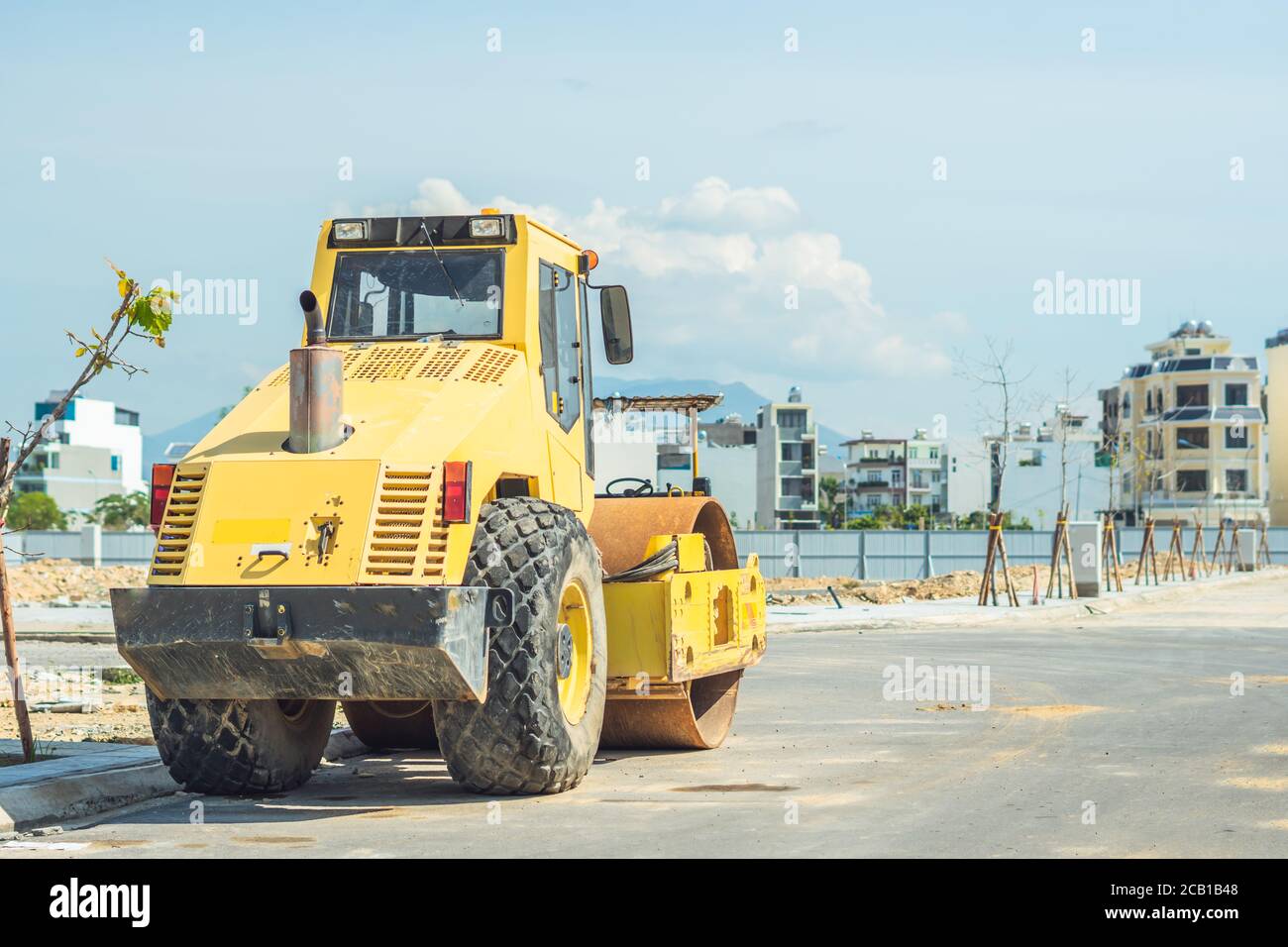 Large view on the big yellow road rollers working on the new modern ...