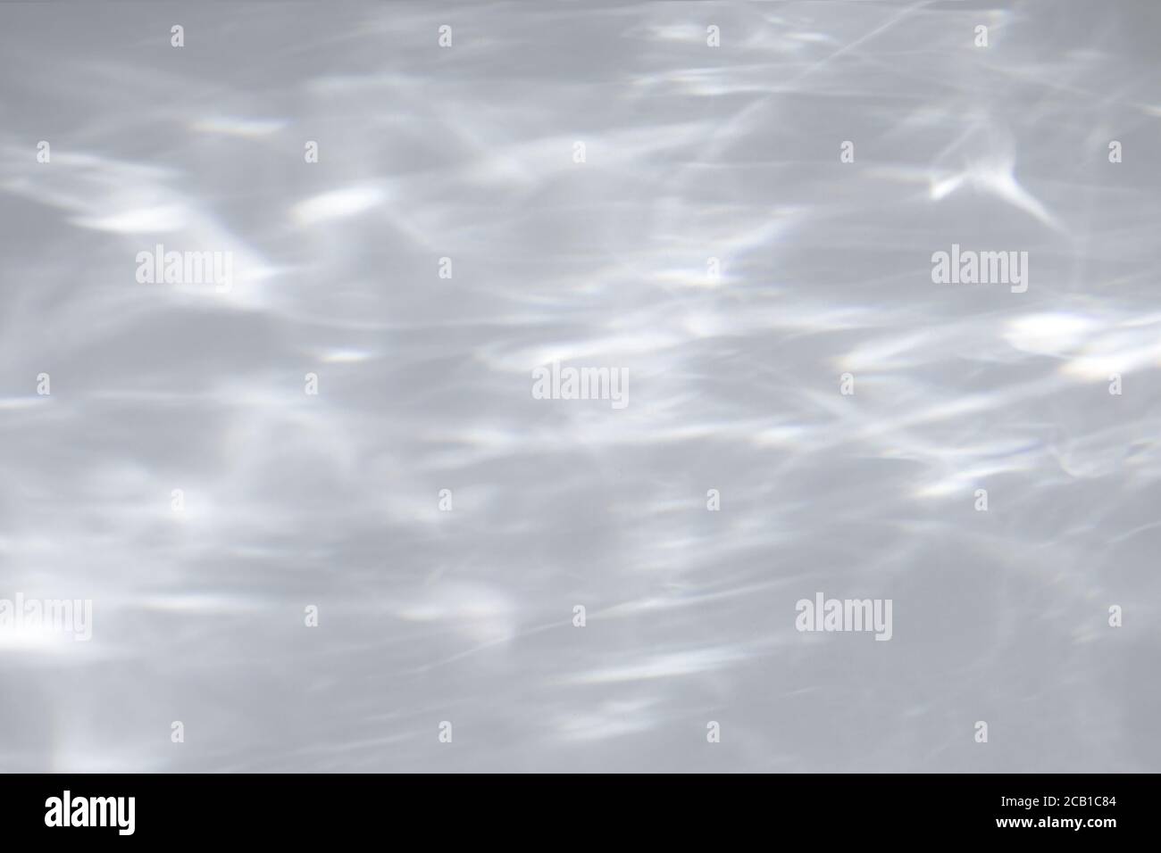 shadow and light caustic effect on a white wall Stock Photo - Alamy