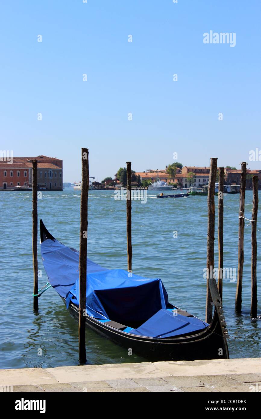 Vertical shot of a gondola near the shore Stock Photo - Alamy
