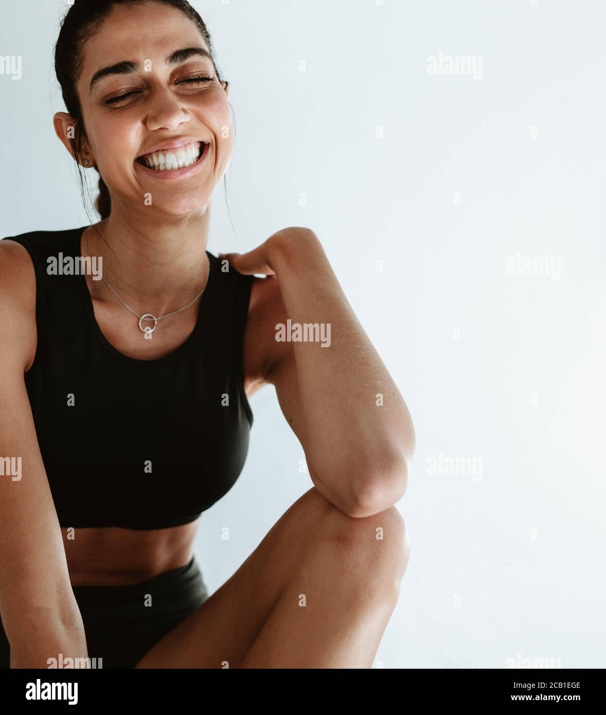 Happy fitness woman taking a break from workout. Woman in sportswear ...