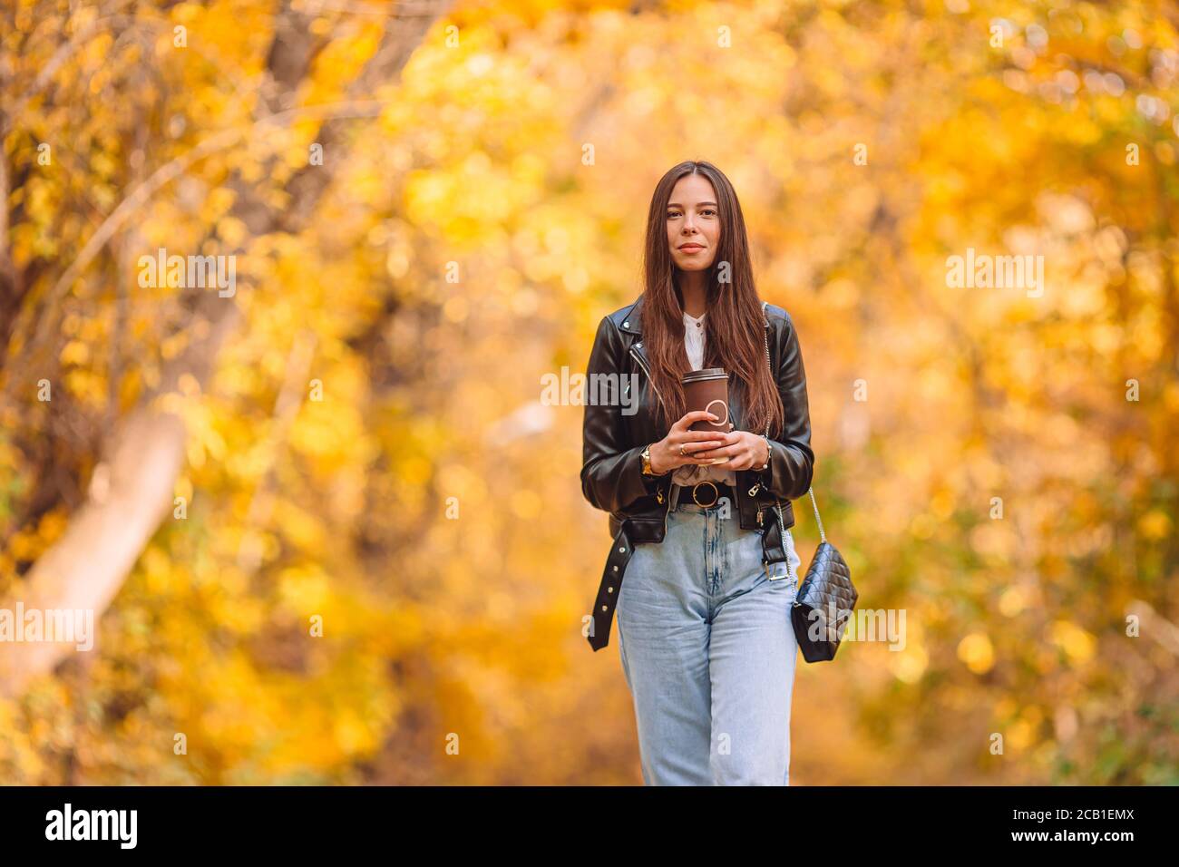 Fall concept - beautiful woman in autumn park under fall foliage Stock ...