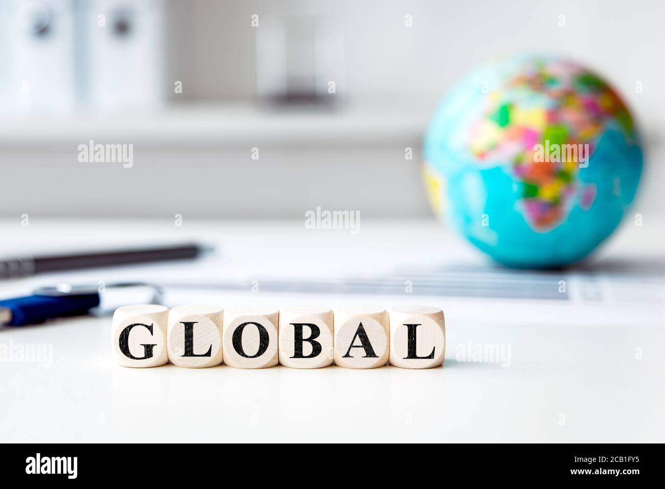 concept picture with globe in a bright office on a desk, concept global ...