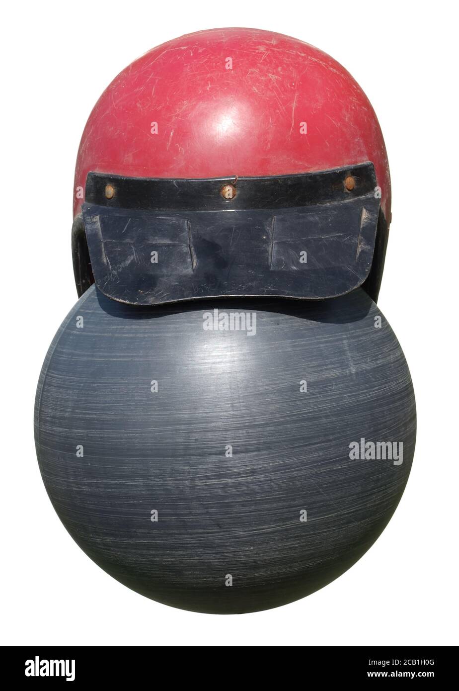 Red motorcycle helmet on a black plastic bowl isolated on white ...