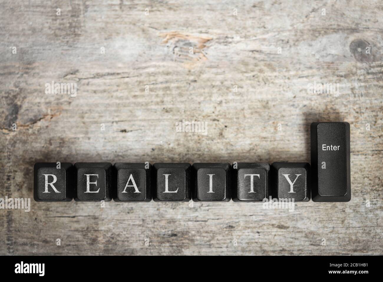 Key buttons with letters, word reality and enter, concept myth and real ...