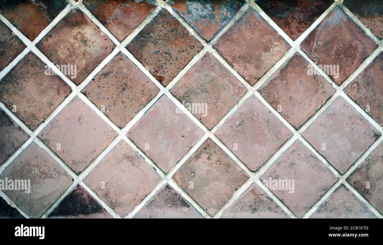 Old porcelain tiles floor texture with tiles of brown and gray colors ...
