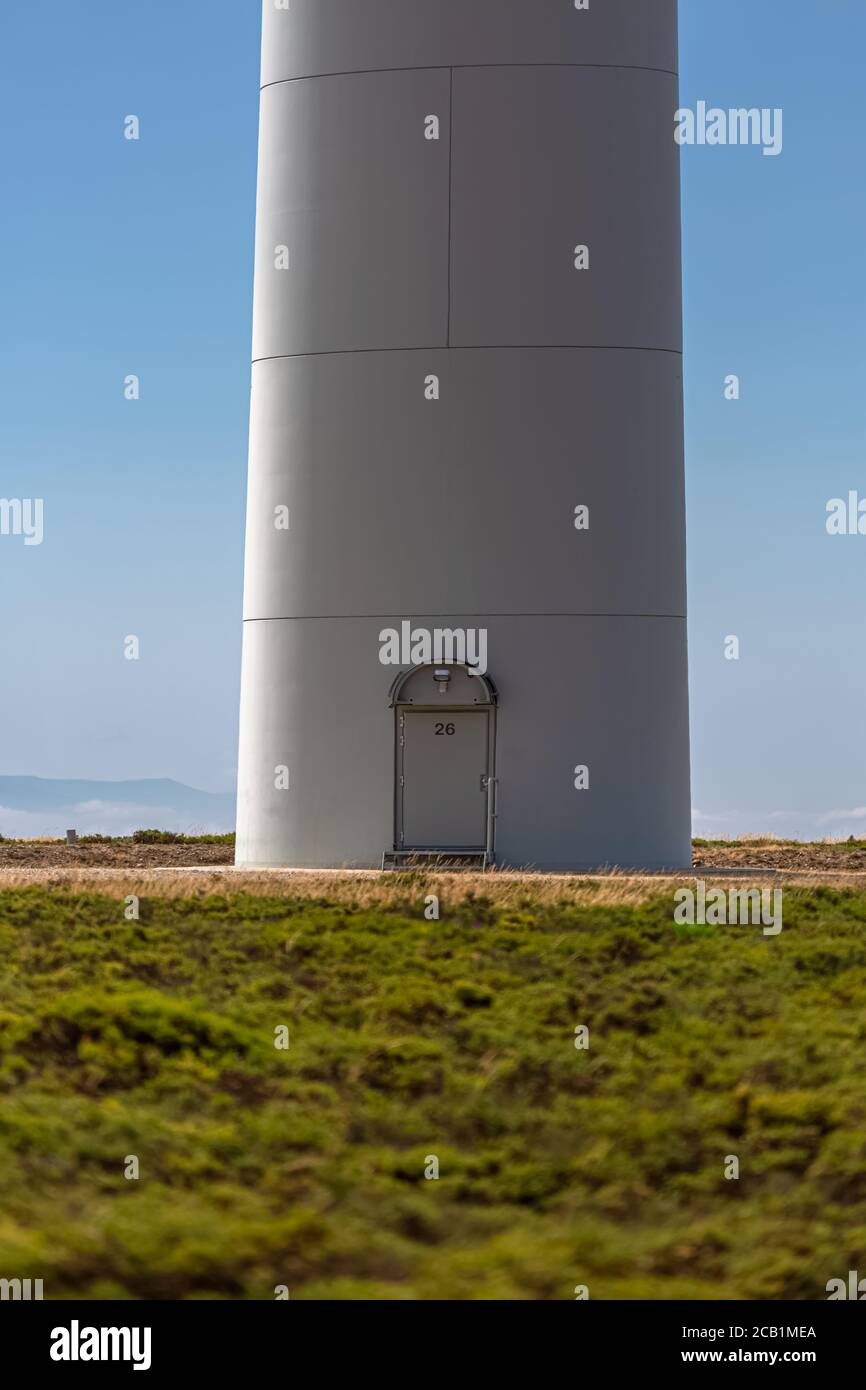 View from the base of the tower of a wind turbine, with access door to ...