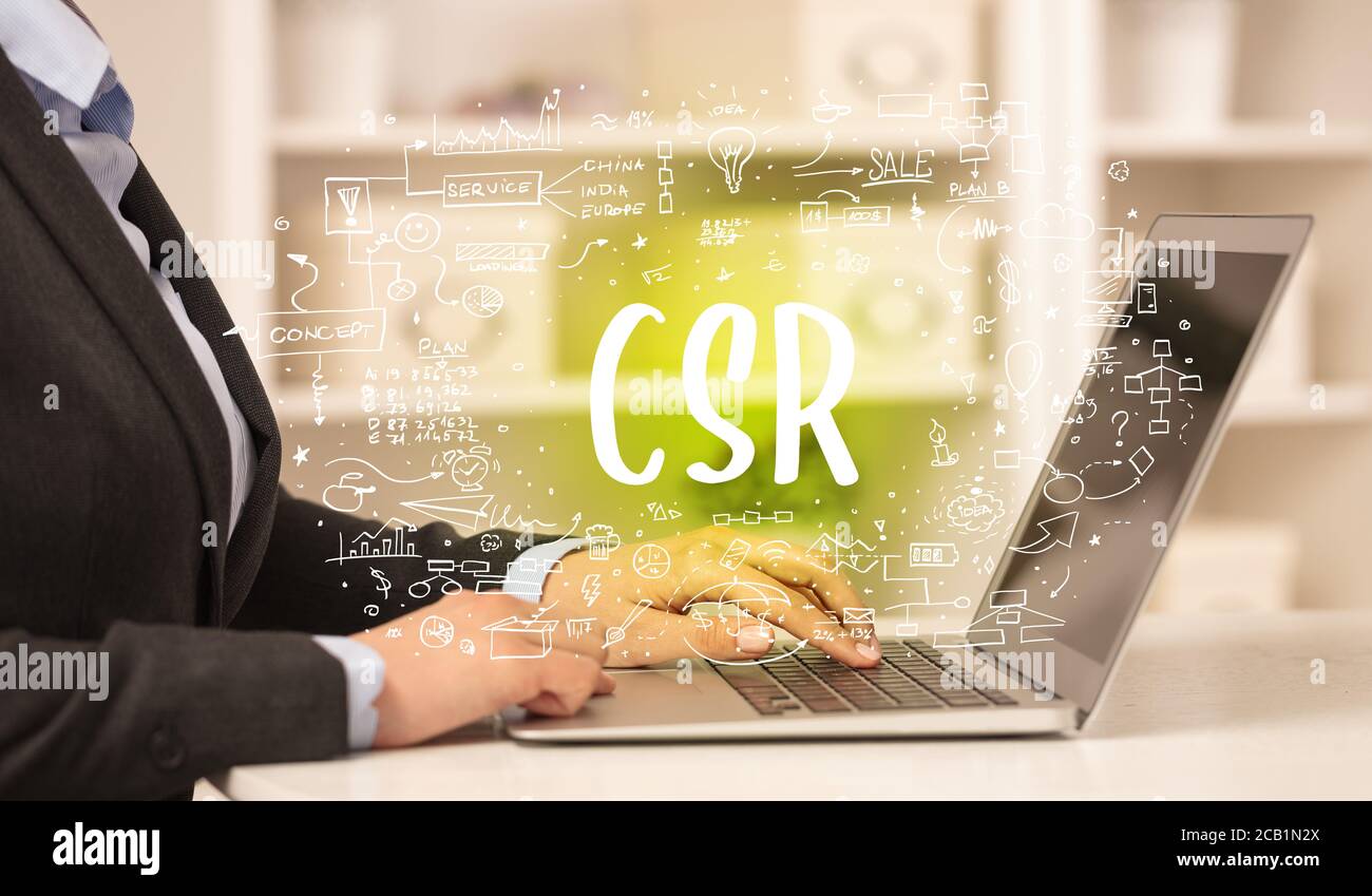 hand working on new modern computer with CSR abbreviation, modern ...