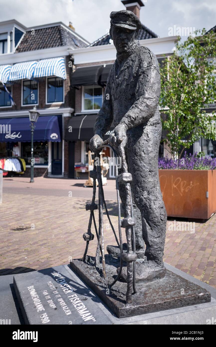 Bronze statue of the De Lemster Fiskerman (fisherman) in the center of ...