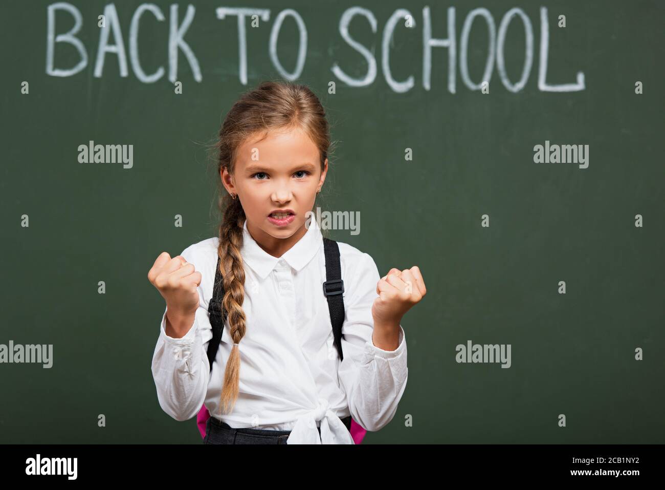 Angry kid at classroom hi-res stock photography and images - Alamy