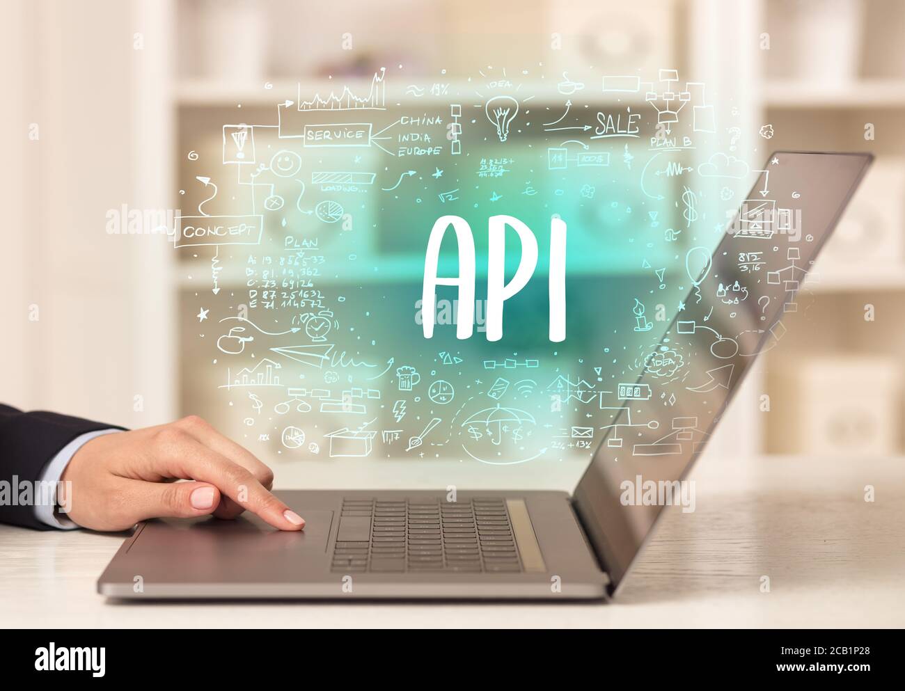 hand working on new modern computer with API abbreviation, modern ...