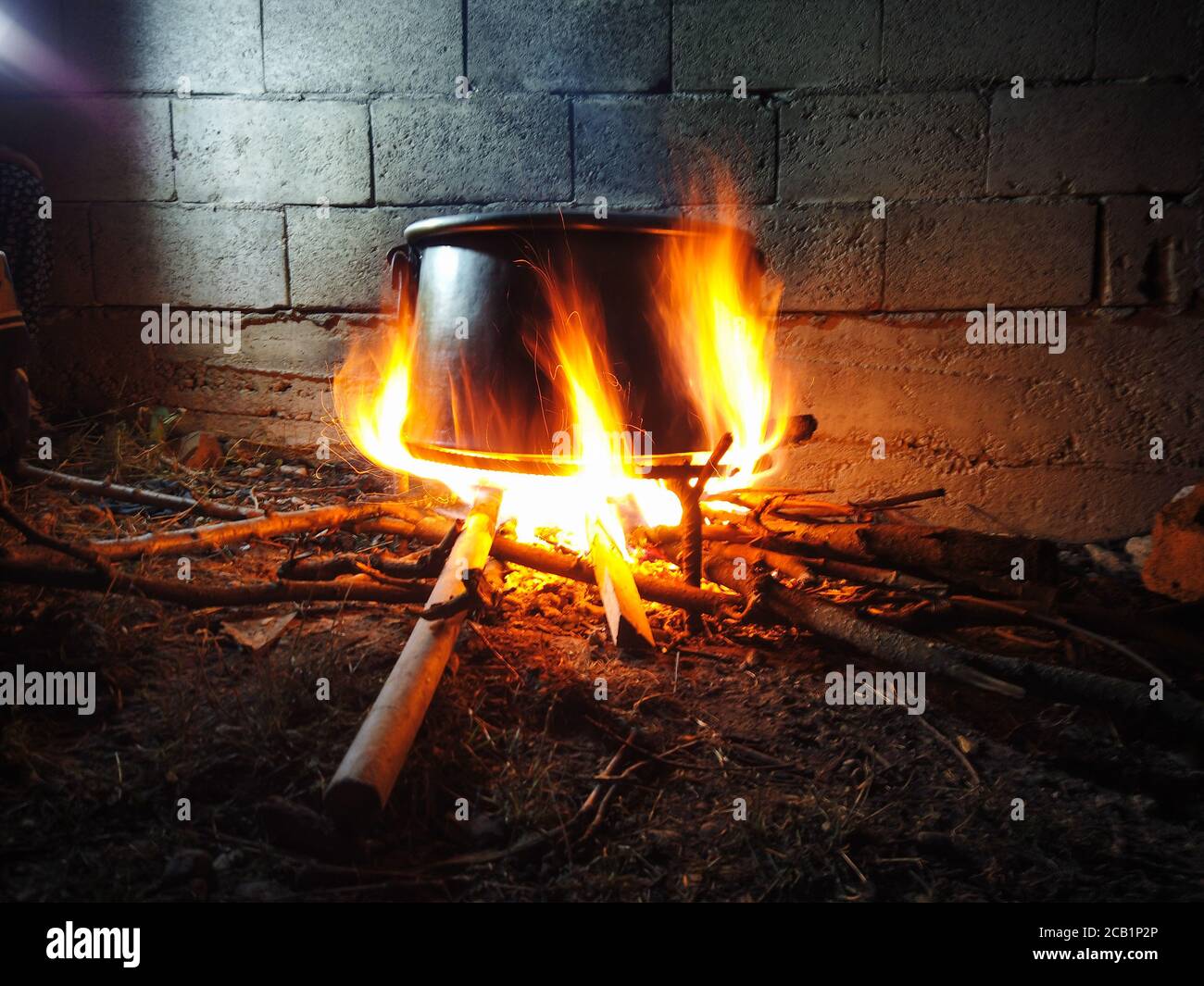 Making mulberry molasses in a large cauldron in wood fire. Cooking in ...