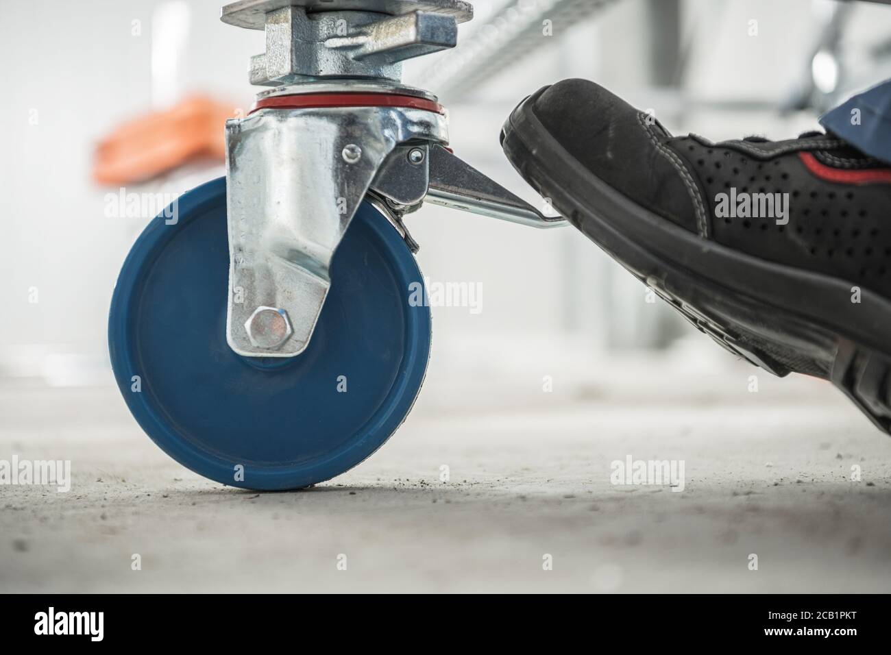 Close Up Of Man In Boots Pushing Down On Scaffolding Wheel Locks To ...