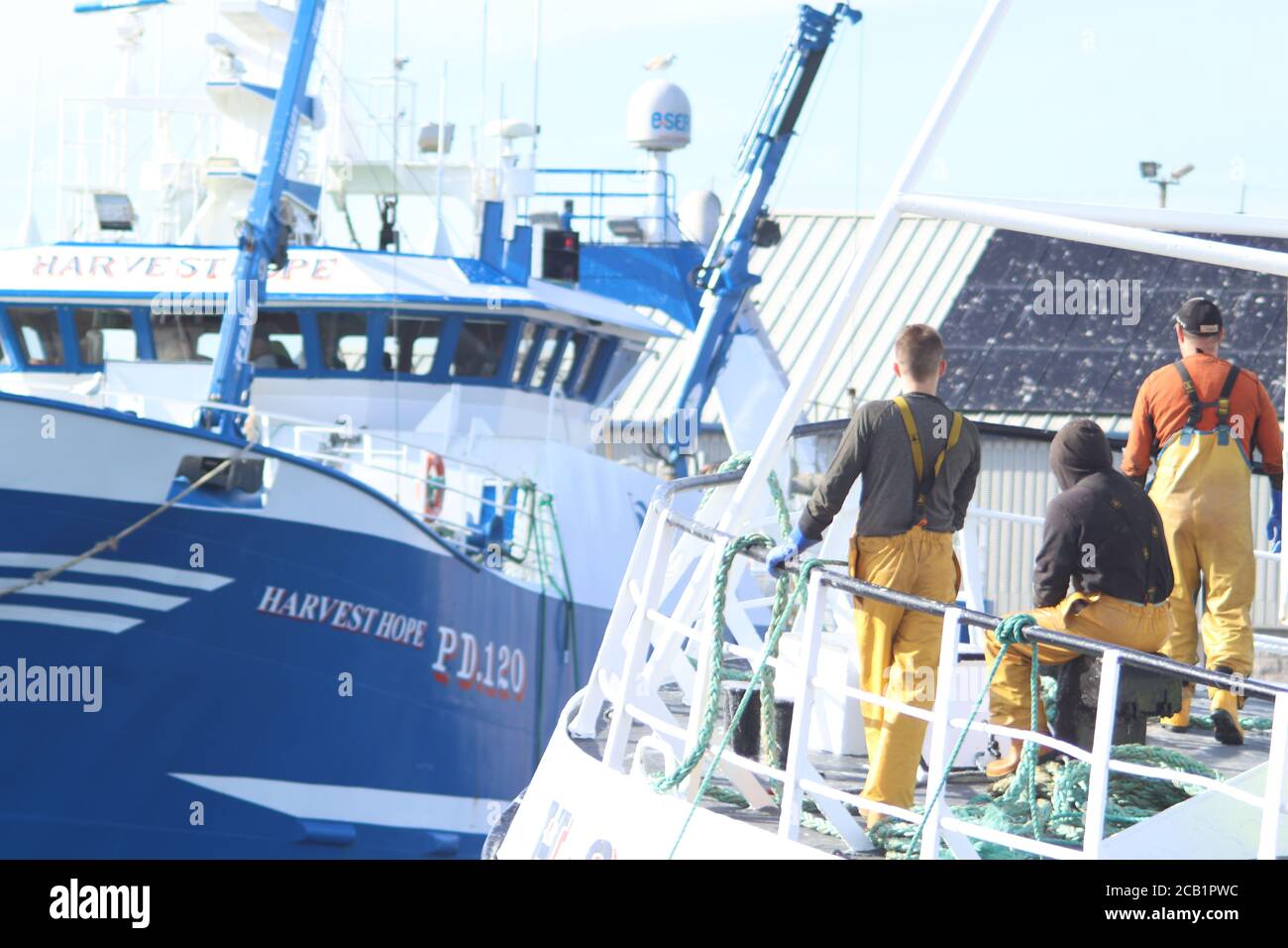 Fishermen on boat Stock Photo - Alamy