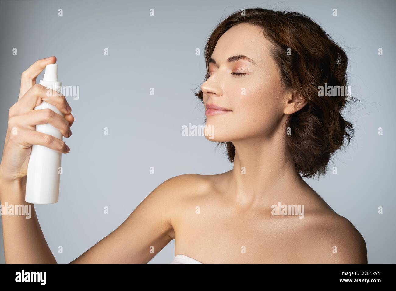 Woman spray bottle face hi-res stock photography and images - Alamy