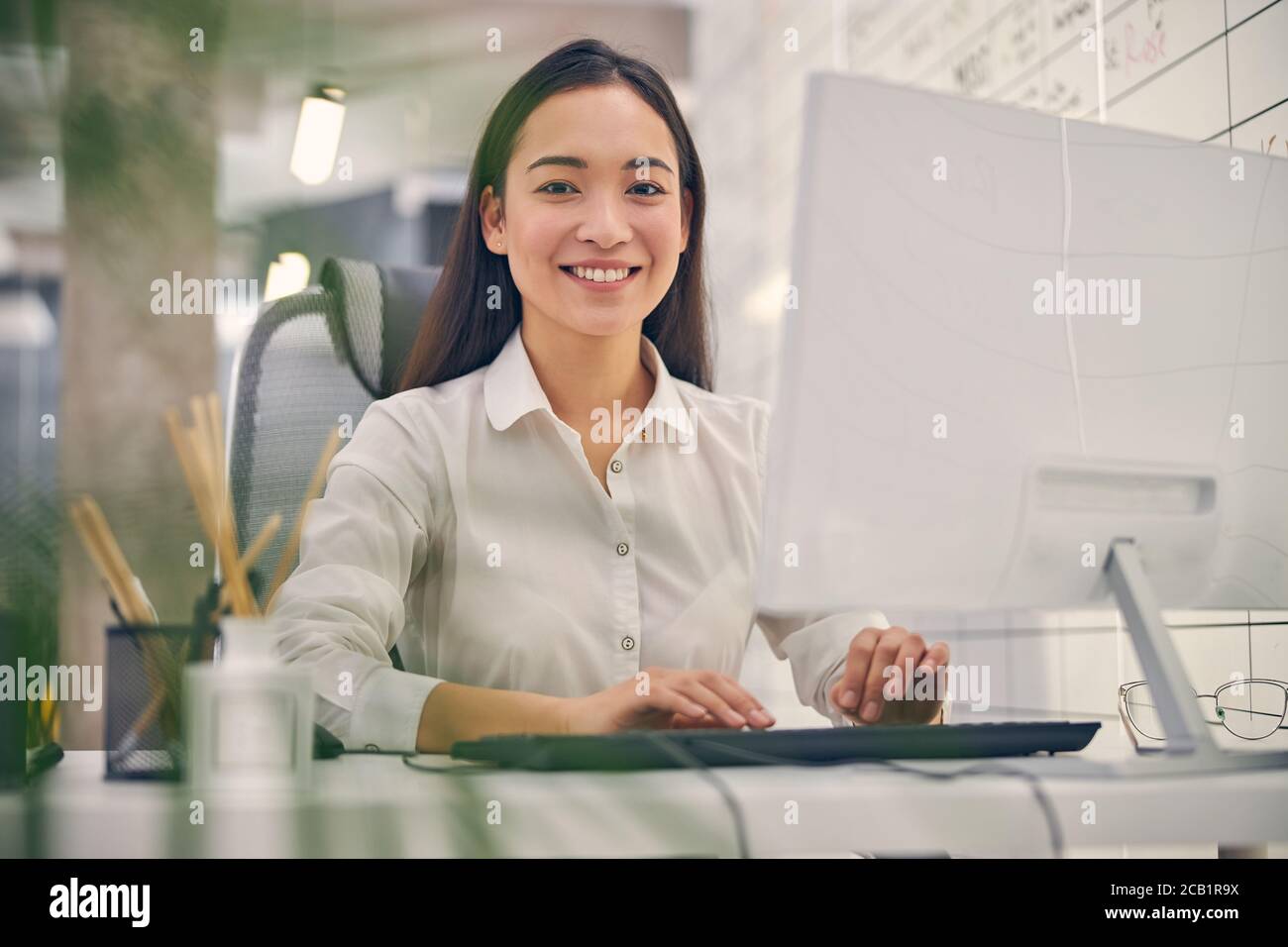 Positive delighted office worker hi-res stock photography and images ...