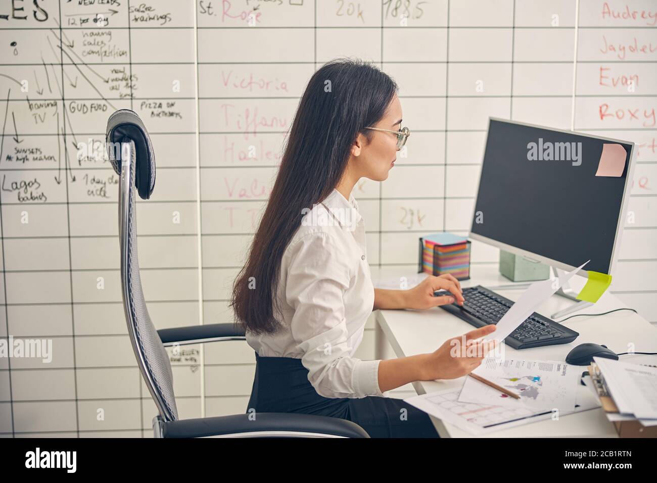 Concentrated woman preparing new document for meeting Stock Photo - Alamy