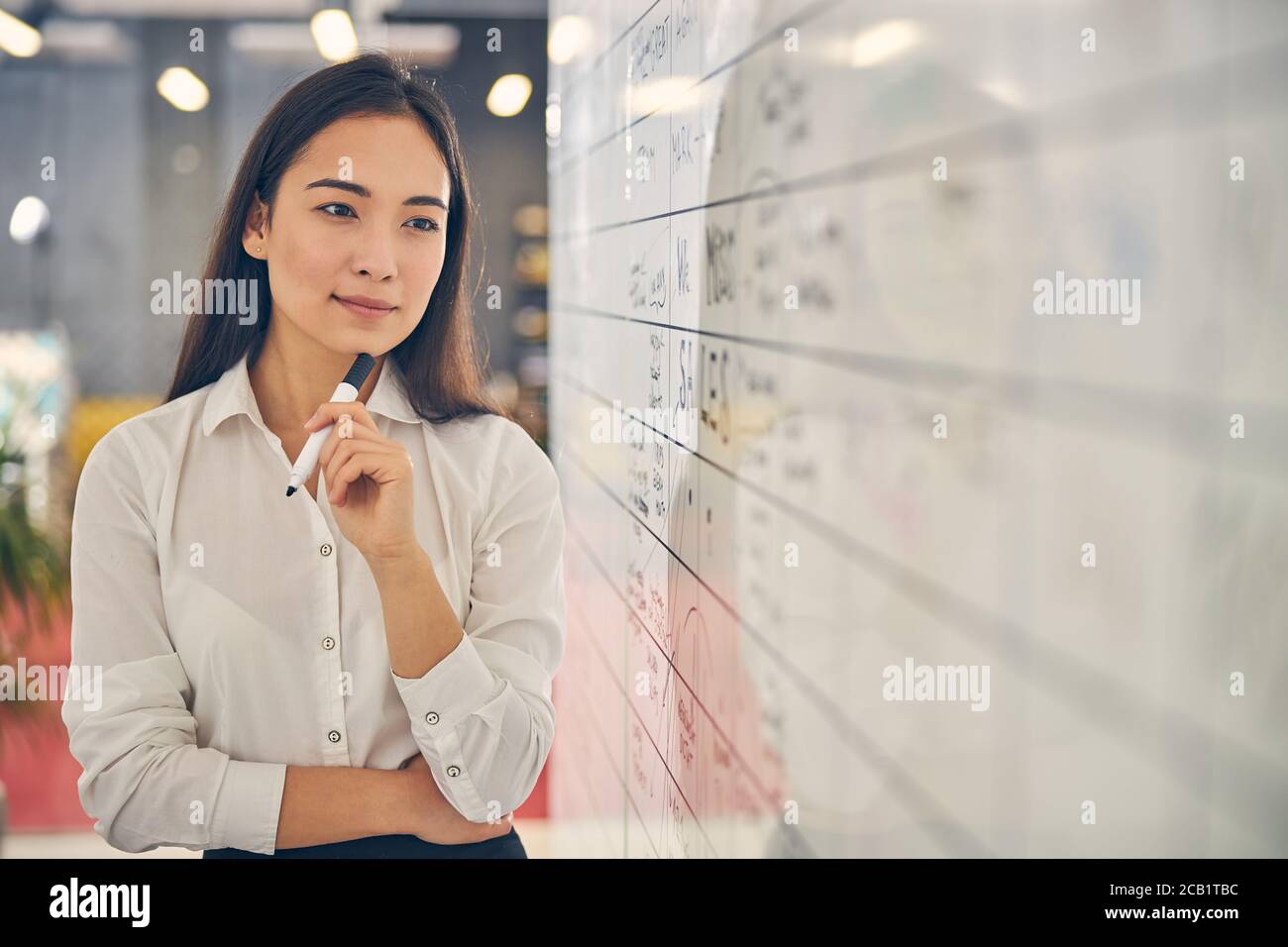Attractive young office worker being deep in thoughts Stock Photo - Alamy