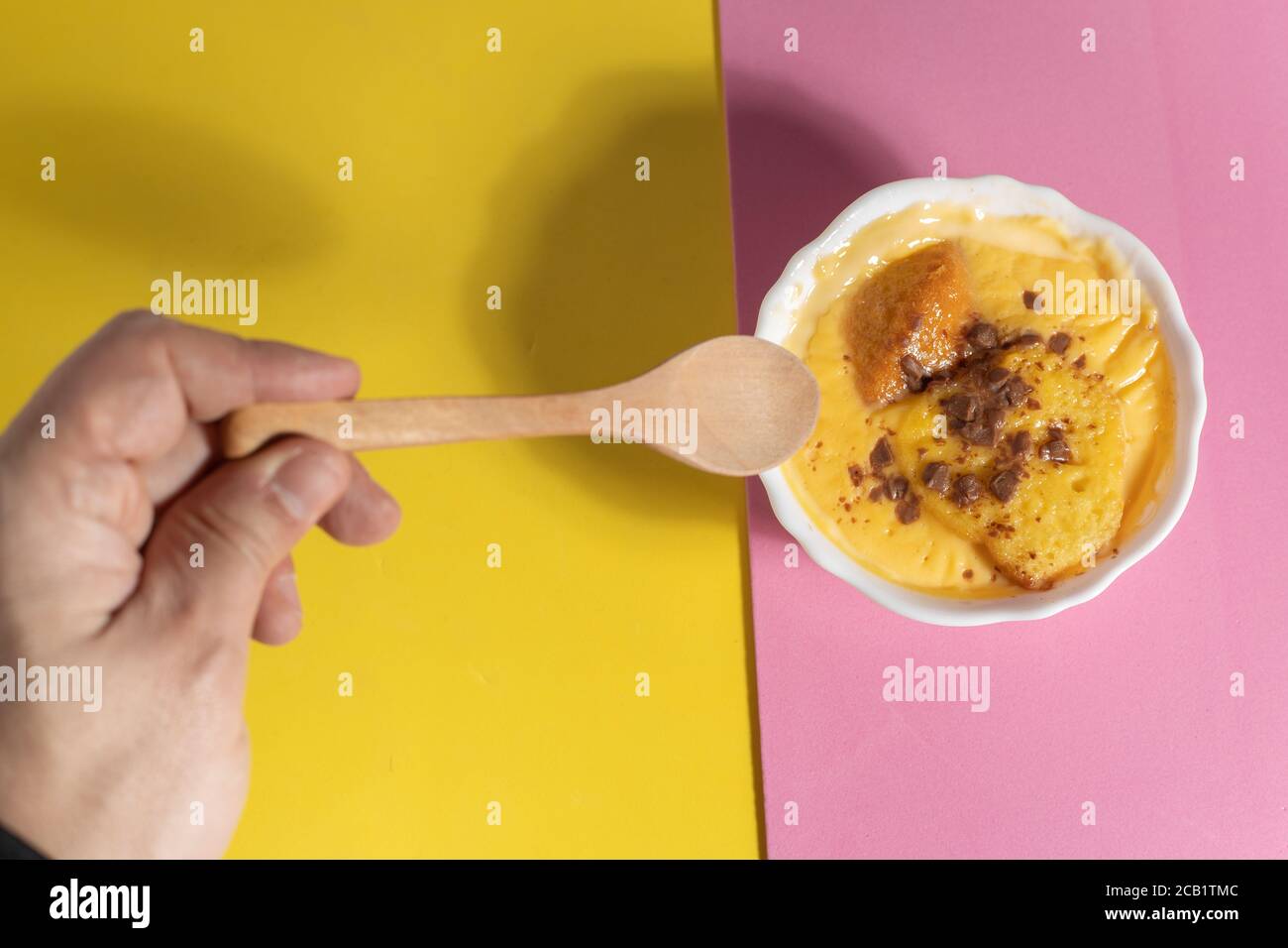 Delicious custard in yellow and pink background Stock Photo - Alamy