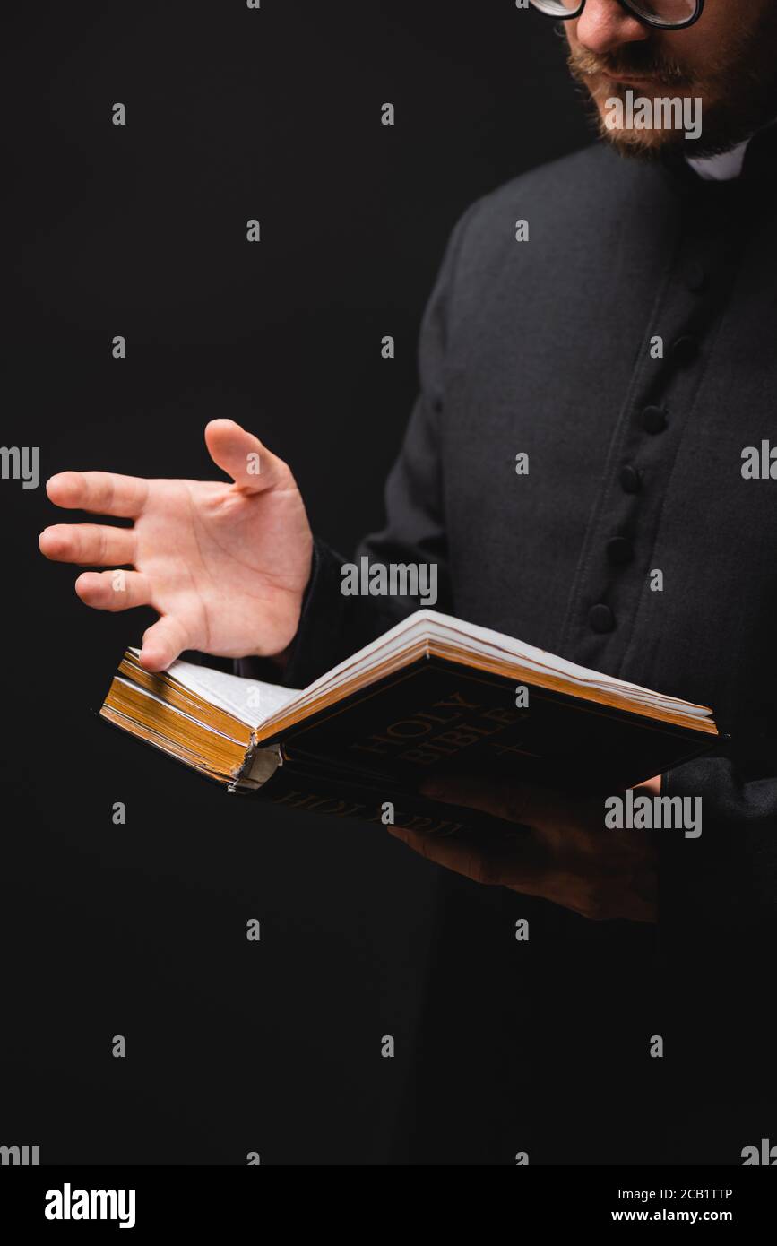Priest holding book holy hi-res stock photography and images - Alamy