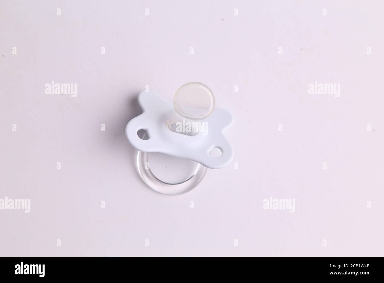 Closeup of a white pacifier isolated on a white background Stock Photo ...