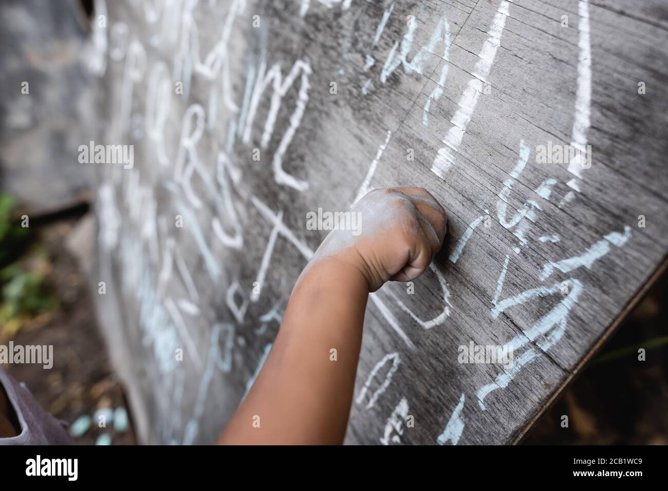 African american child writing hi-res stock photography and images - Alamy