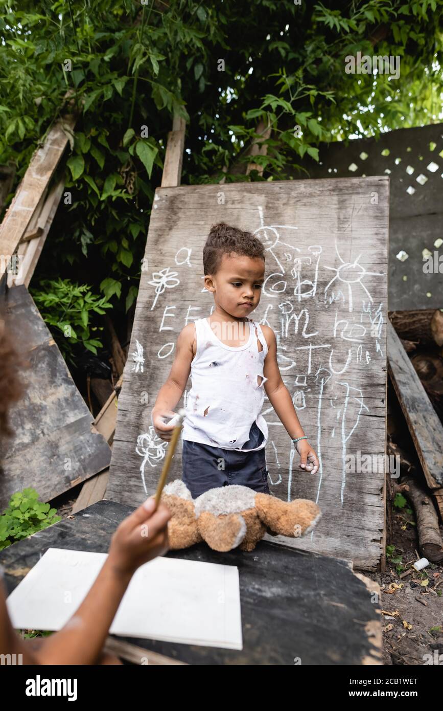 Children stand near table hi-res stock photography and images - Alamy