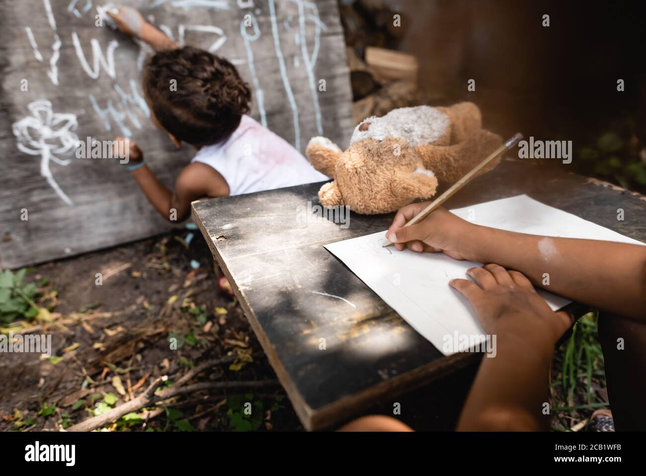 African american child writing hi-res stock photography and images - Alamy