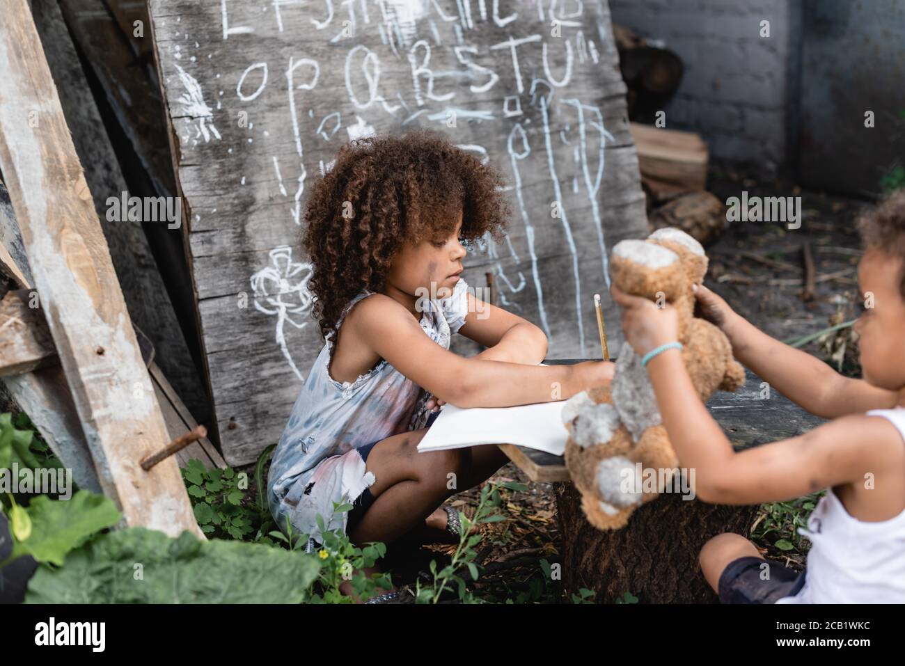 Children playing toy bear selective hi-res stock photography and images ...