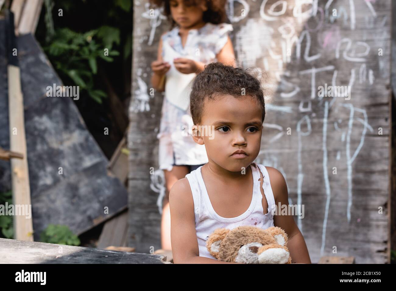 Poor girl and torn clothes hi-res stock photography and images - Alamy