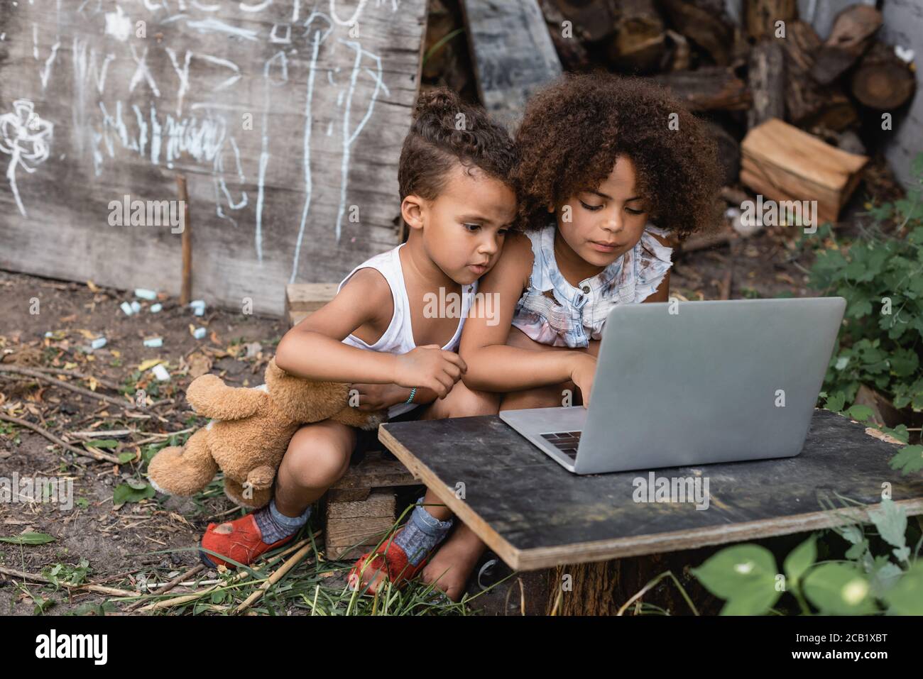 Poor black kids with laptop hi-res stock photography and images - Alamy