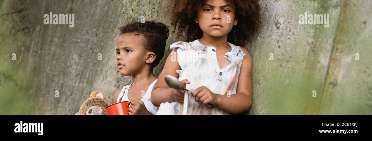 Panoramic orientation of african american kids begging alms near ...
