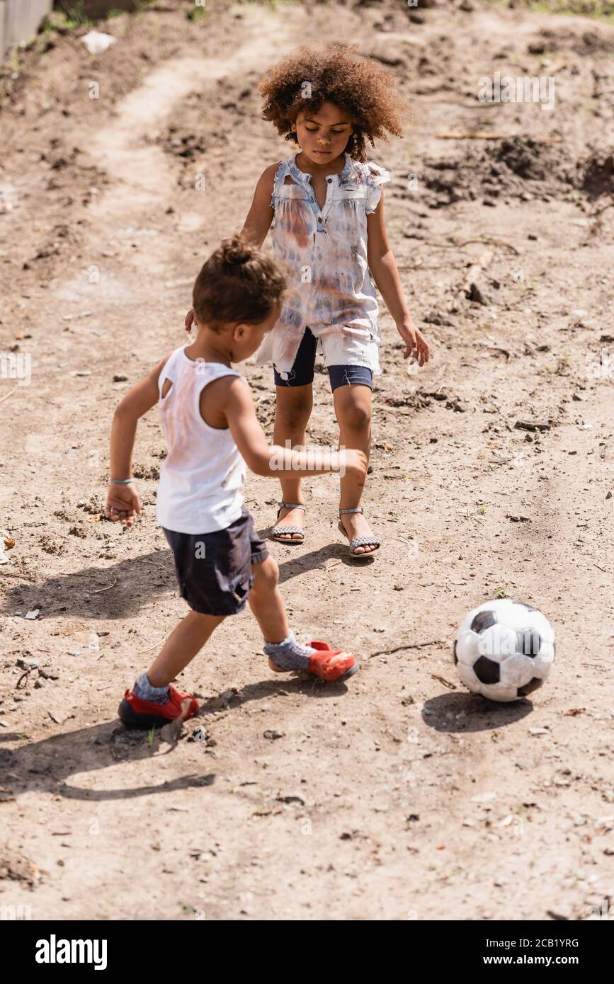 Kids Playing American Football In The Street