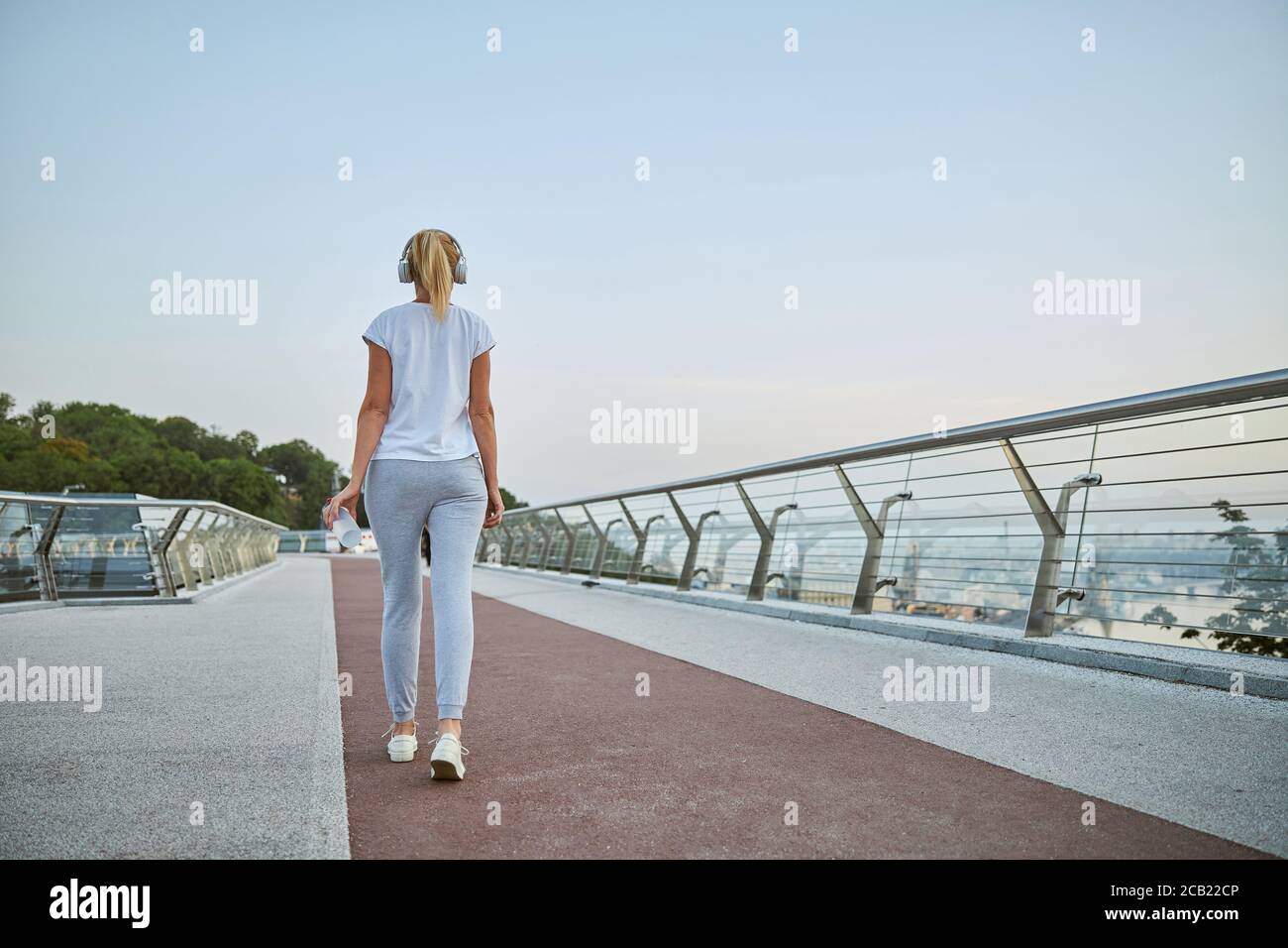 Woman walking forward, back hi-res stock photography and images - Alamy
