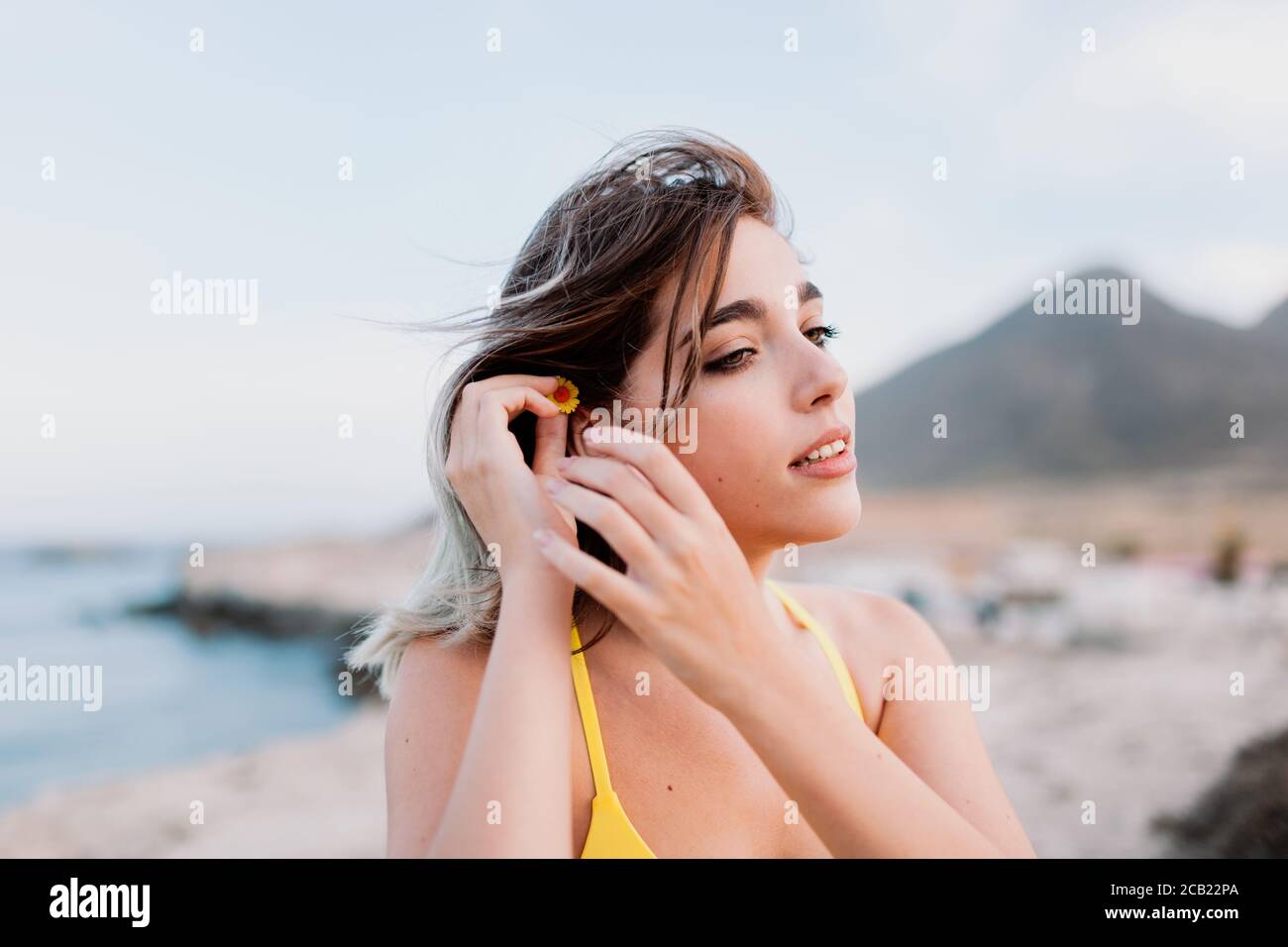 Young woman in yellow bikini hi-res stock photography and images - Alamy