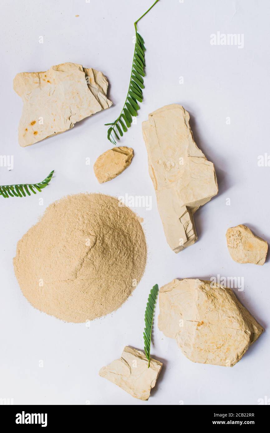 organic dry clay powder on white background. natural clay powder for ...
