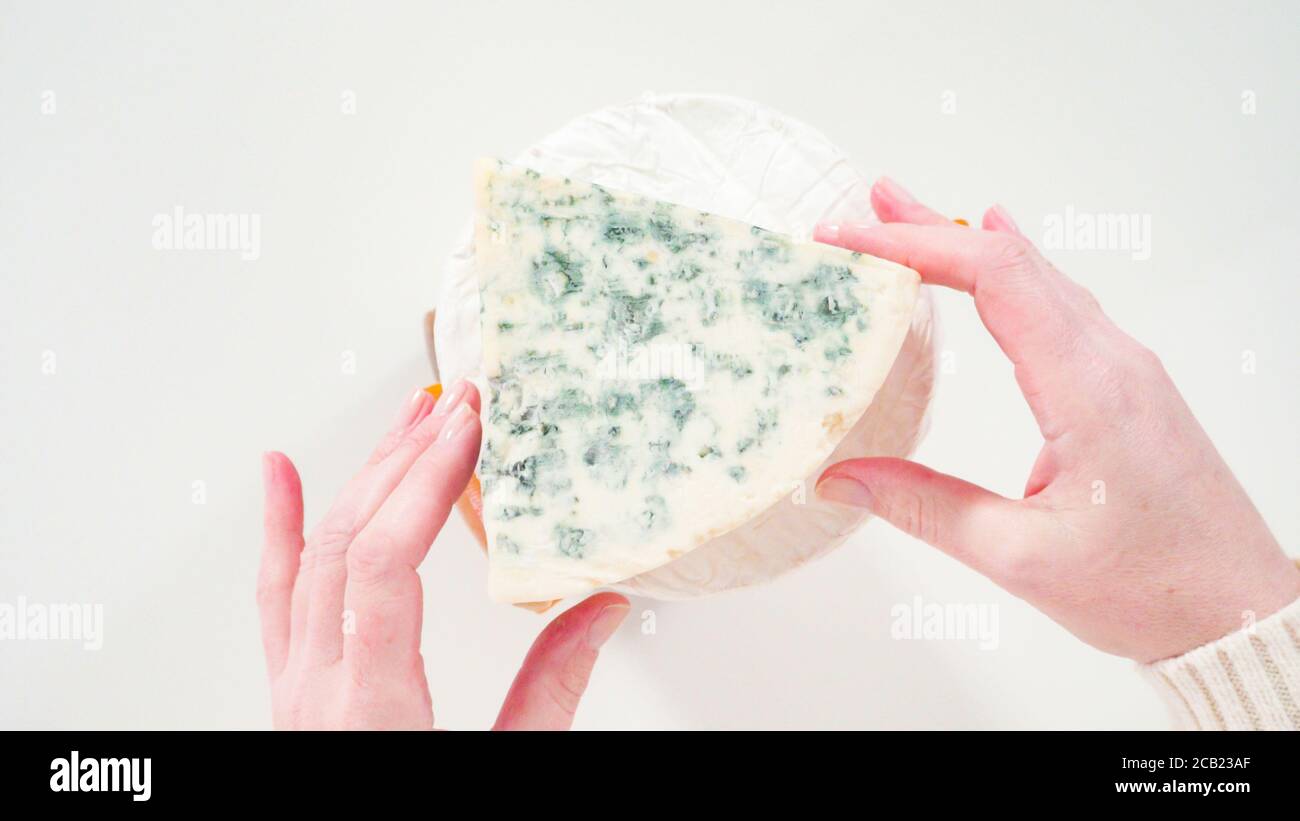 Flat lay. Large slice of gourmet cheese on a white background Stock ...