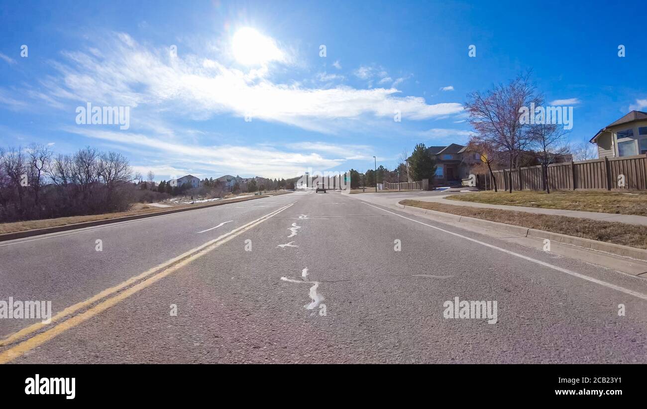 Driving on typical paved roads in a suburban upscale residential ...