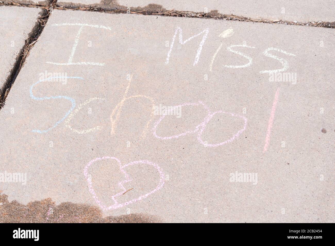 I miss school chalk sign in driveway Stock Photo - Alamy