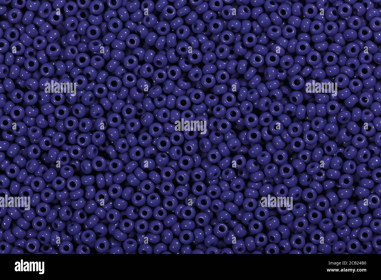 Dark blue beads in texture form close up Stock Photo - Alamy