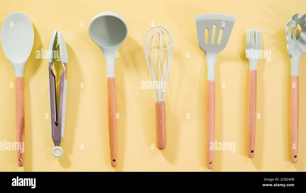 Flat lay. Silicone cooking utensils with wooden handle Stock Photo - Alamy