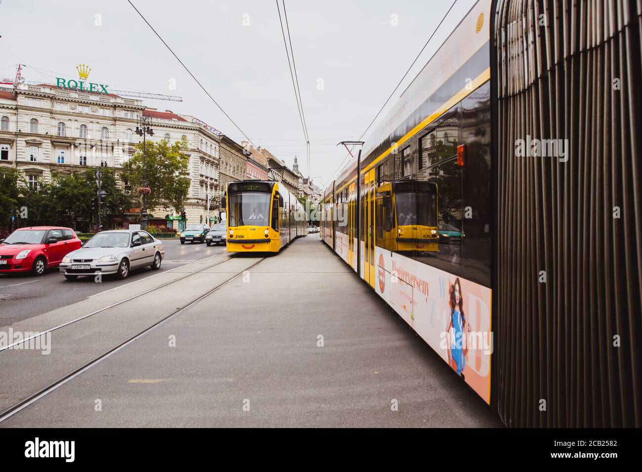 BUDAPEST, HUNGARY - SEPTEMBER 29, 2018: Yellow trams with a smile on ...