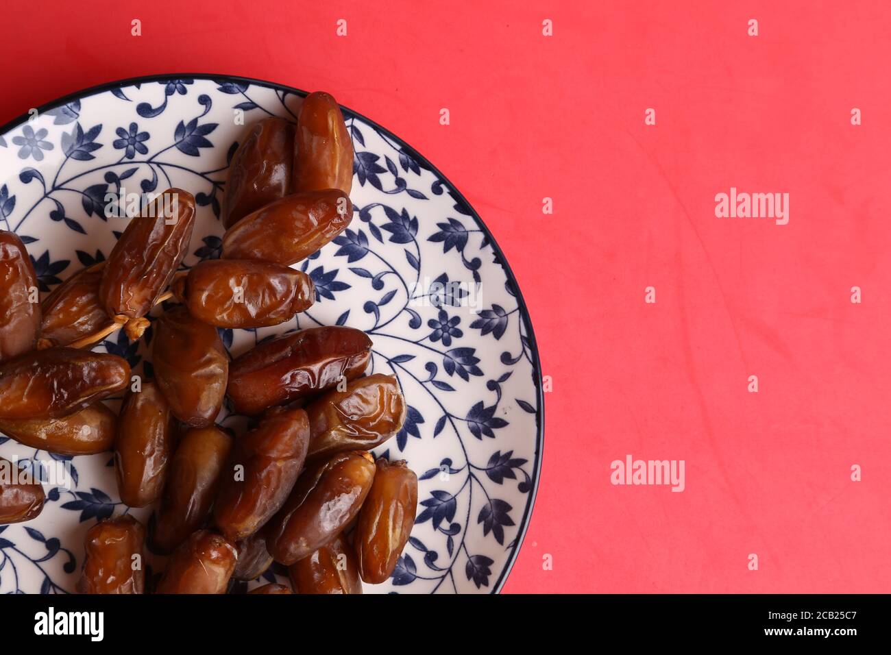 Flat lay shot of dates on a plate Stock Photo - Alamy
