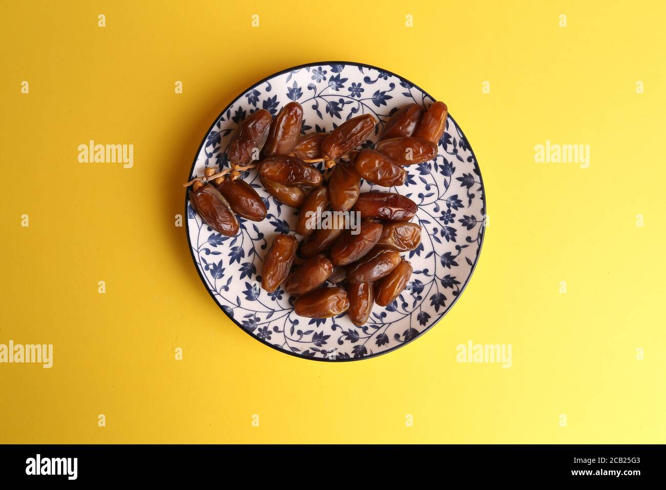 Delicious dry date fruits on the plate Stock Photo - Alamy