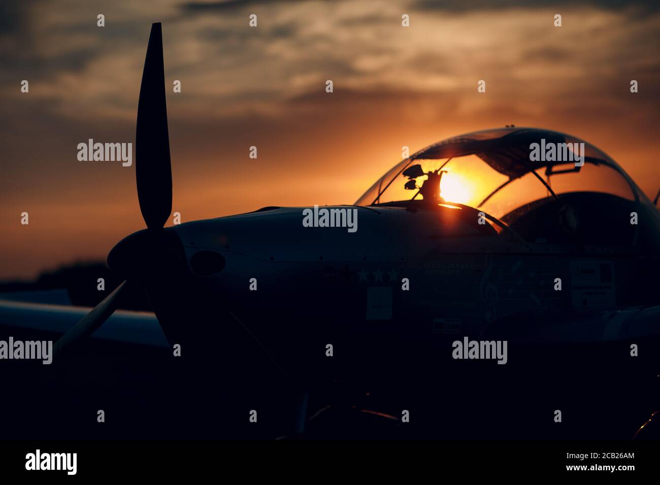 Small private single engine propeller airplane at sunset regional ...