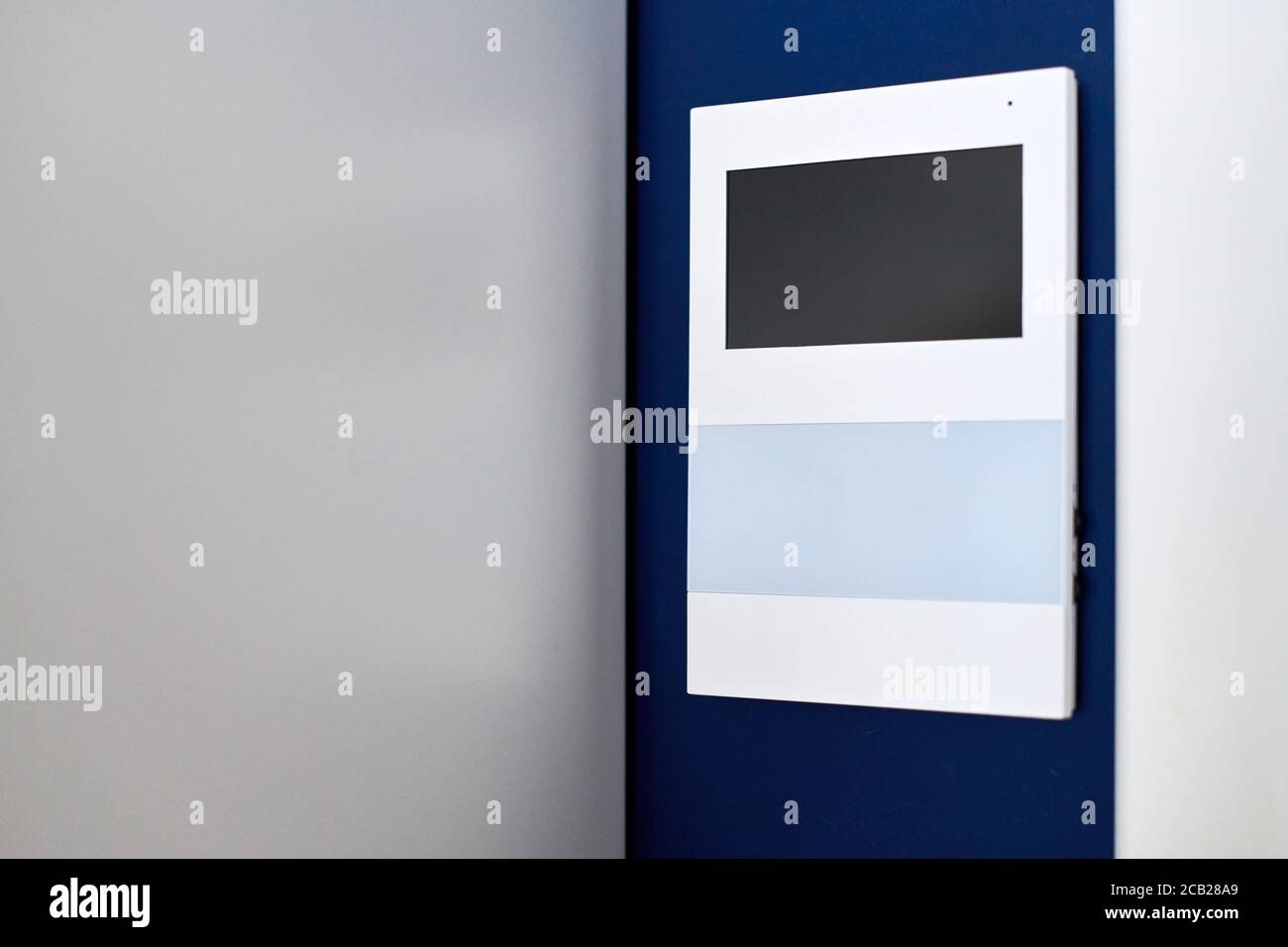 Video intercom on wall. Video door phone. Modern minimalistic sensor ...