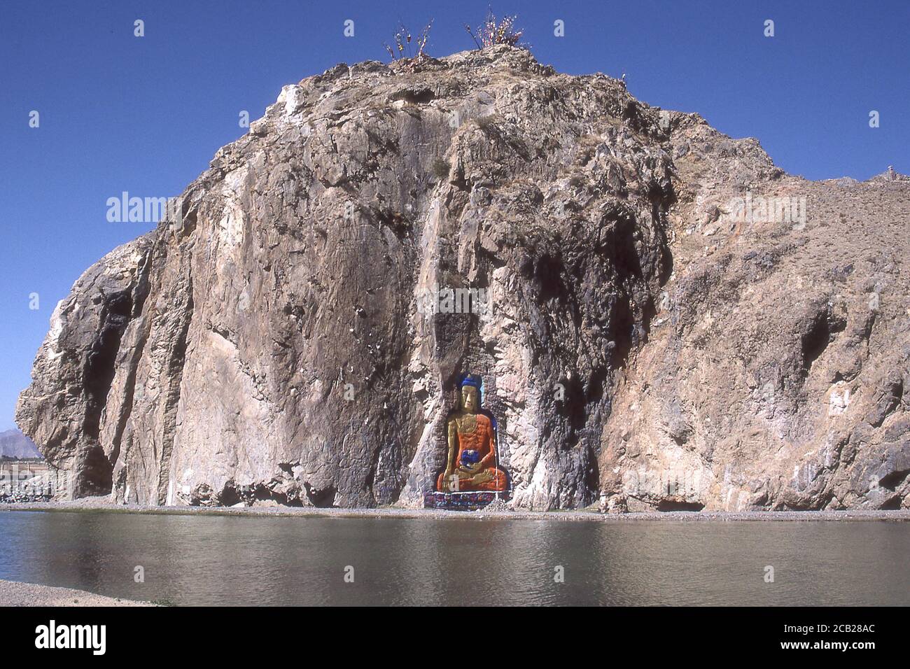 TIBET - BUDDHA CARVED INTO ROCK NEAR LHASA Stock Photo - Alamy
