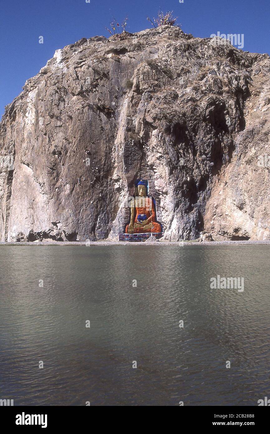TIBET - BUDDHA CARVED INTO ROCK NEAR LHASA Stock Photo - Alamy