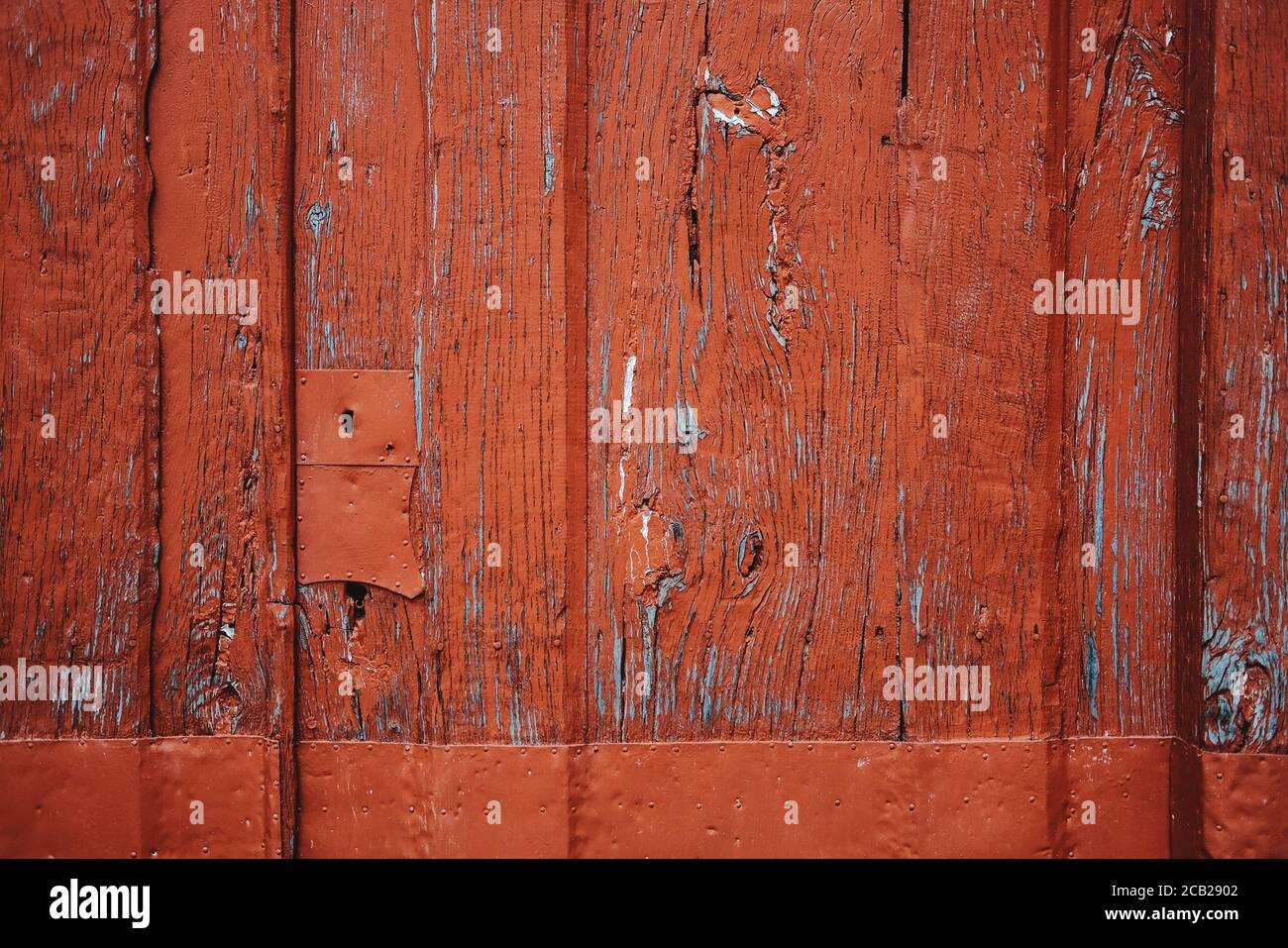 Closeup shot of an orange wooden door for background texture or ...