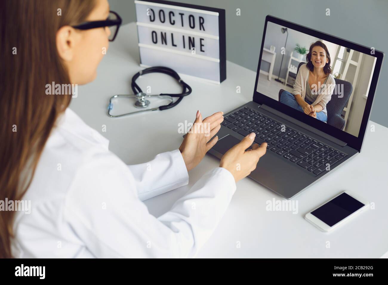 Online medical consultation. The patient and the doctor are talking to ...