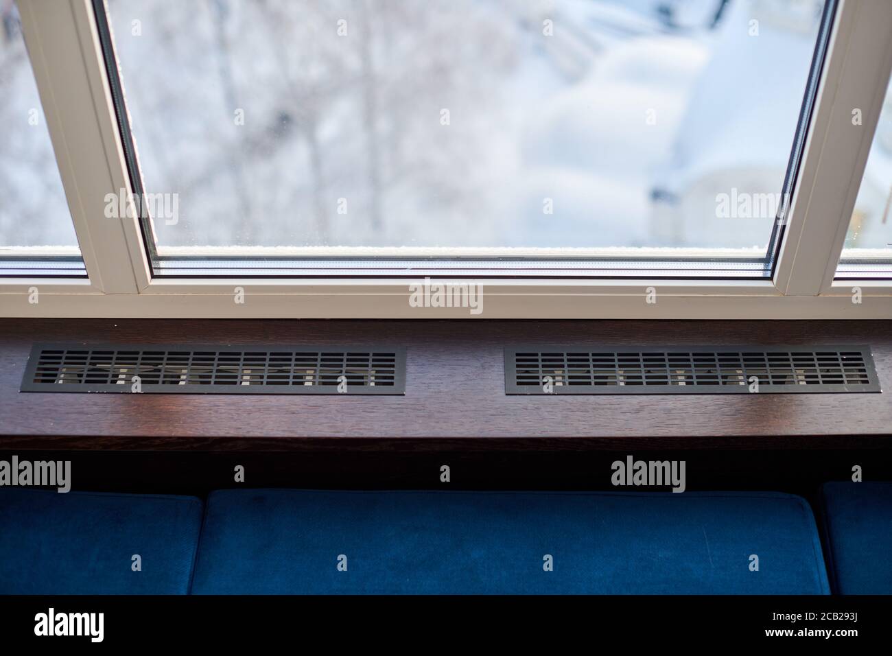 Windowsill, heating grid ventilation. Winter apartment heating. Modern ...